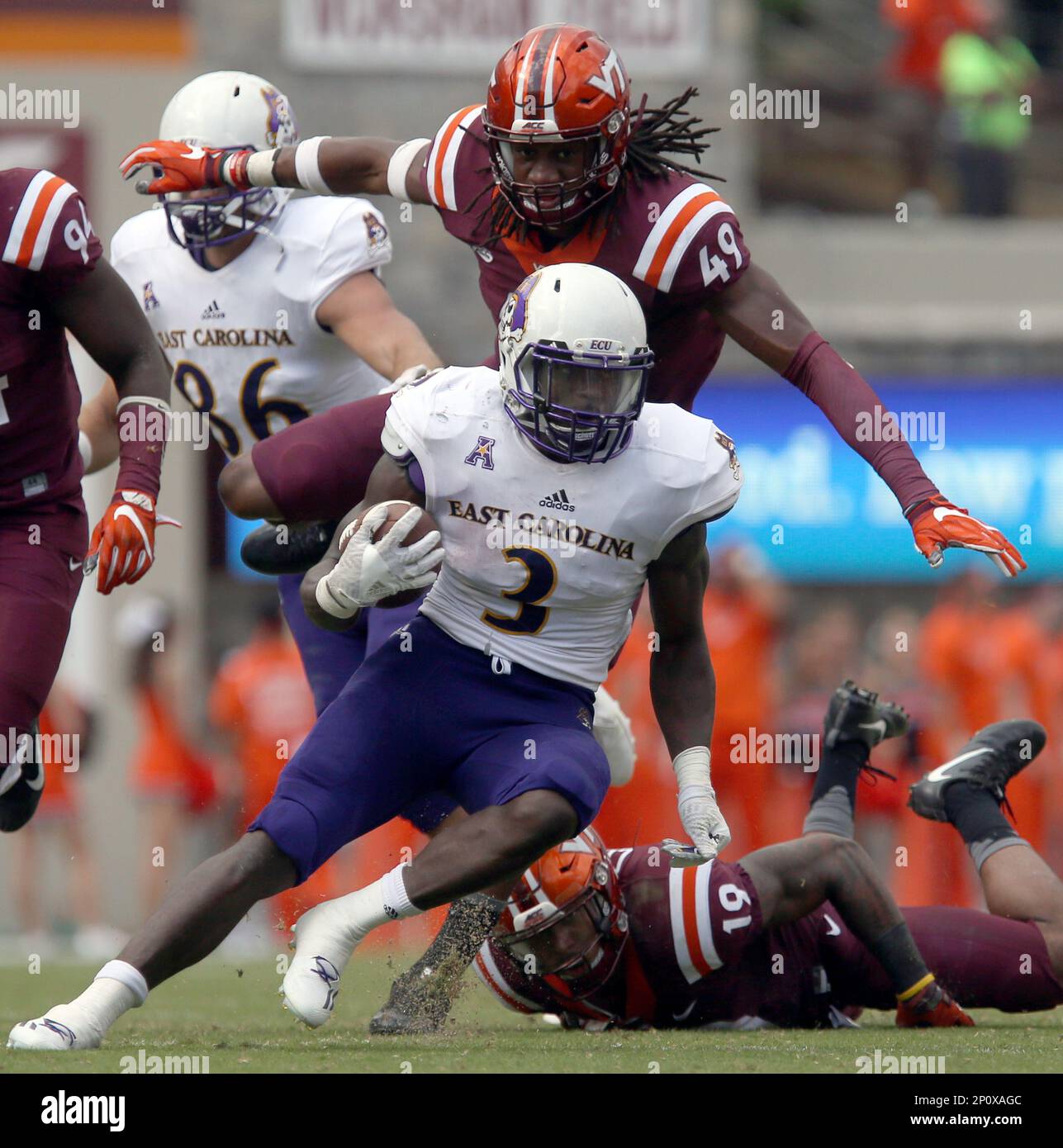 East Carolina running back Anthony Scott (3) is chased by Virginia Tech ...