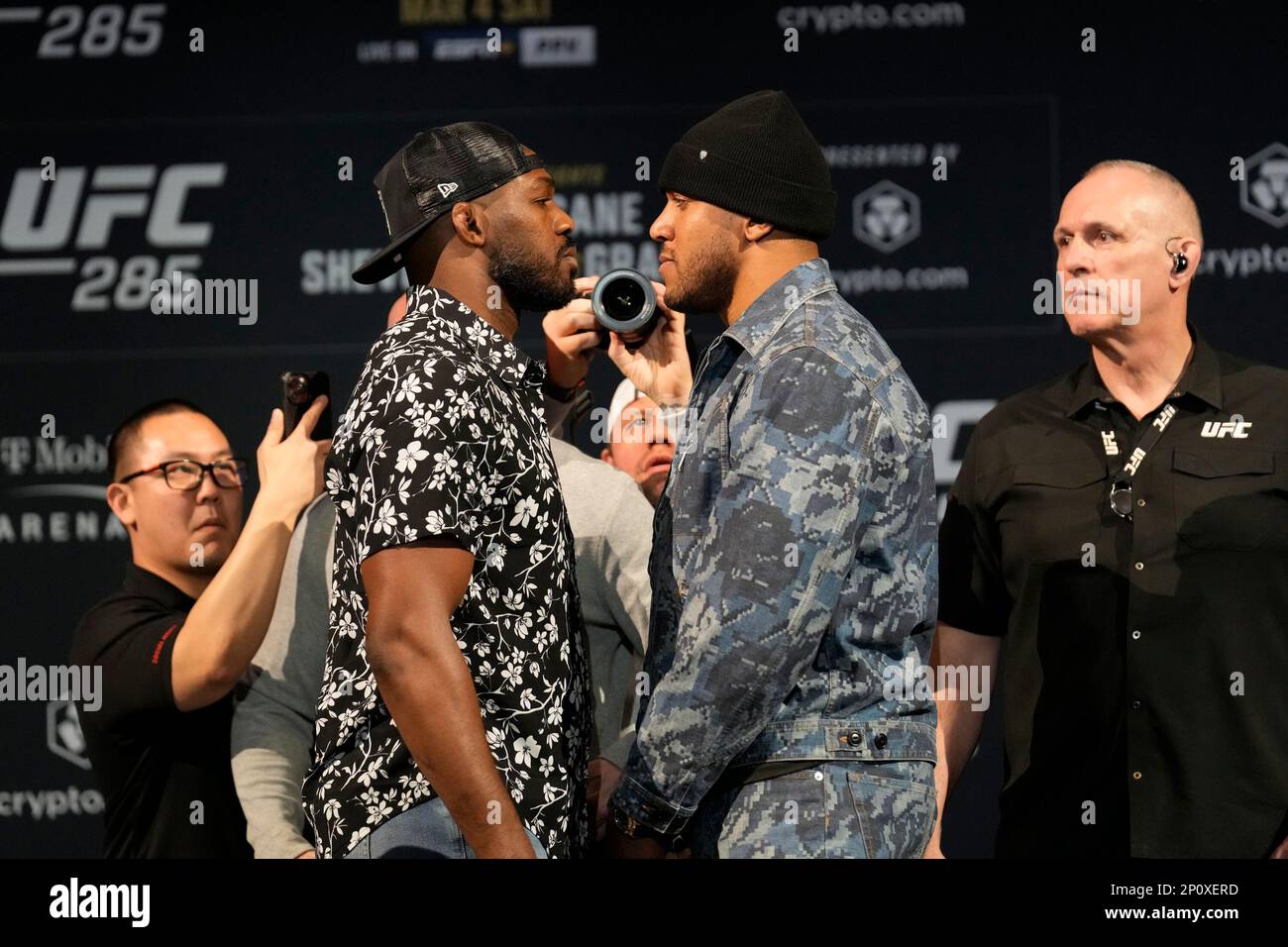 LAS VEGAS, NV - March 2: (L) Jon Jones and Cyril Gane face-off on stage ...