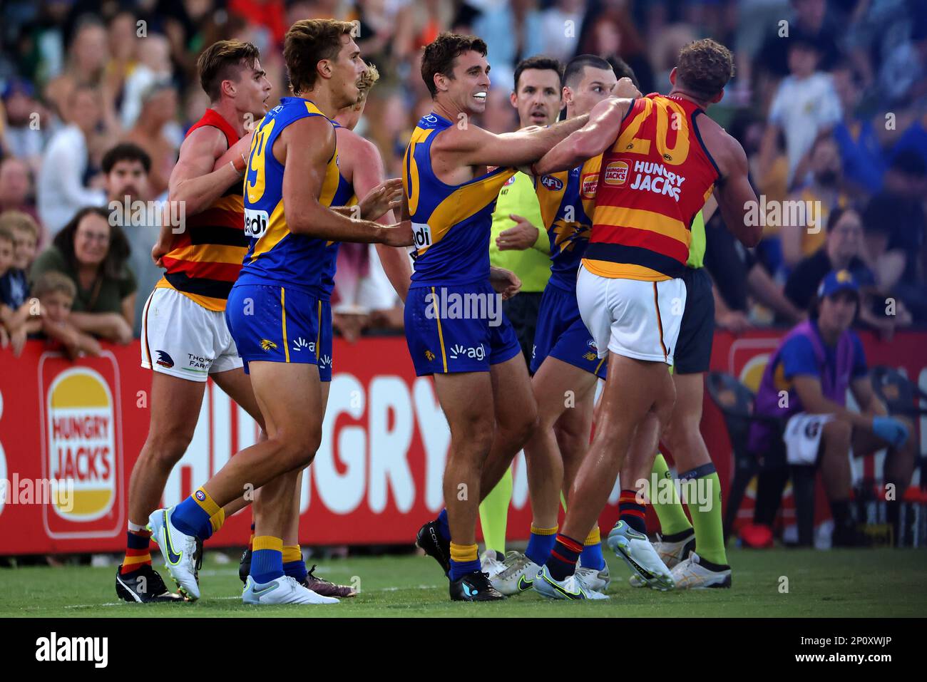 Jamie Cripps of the Eagles scuffles with Mitch Hinge of the Crows ...