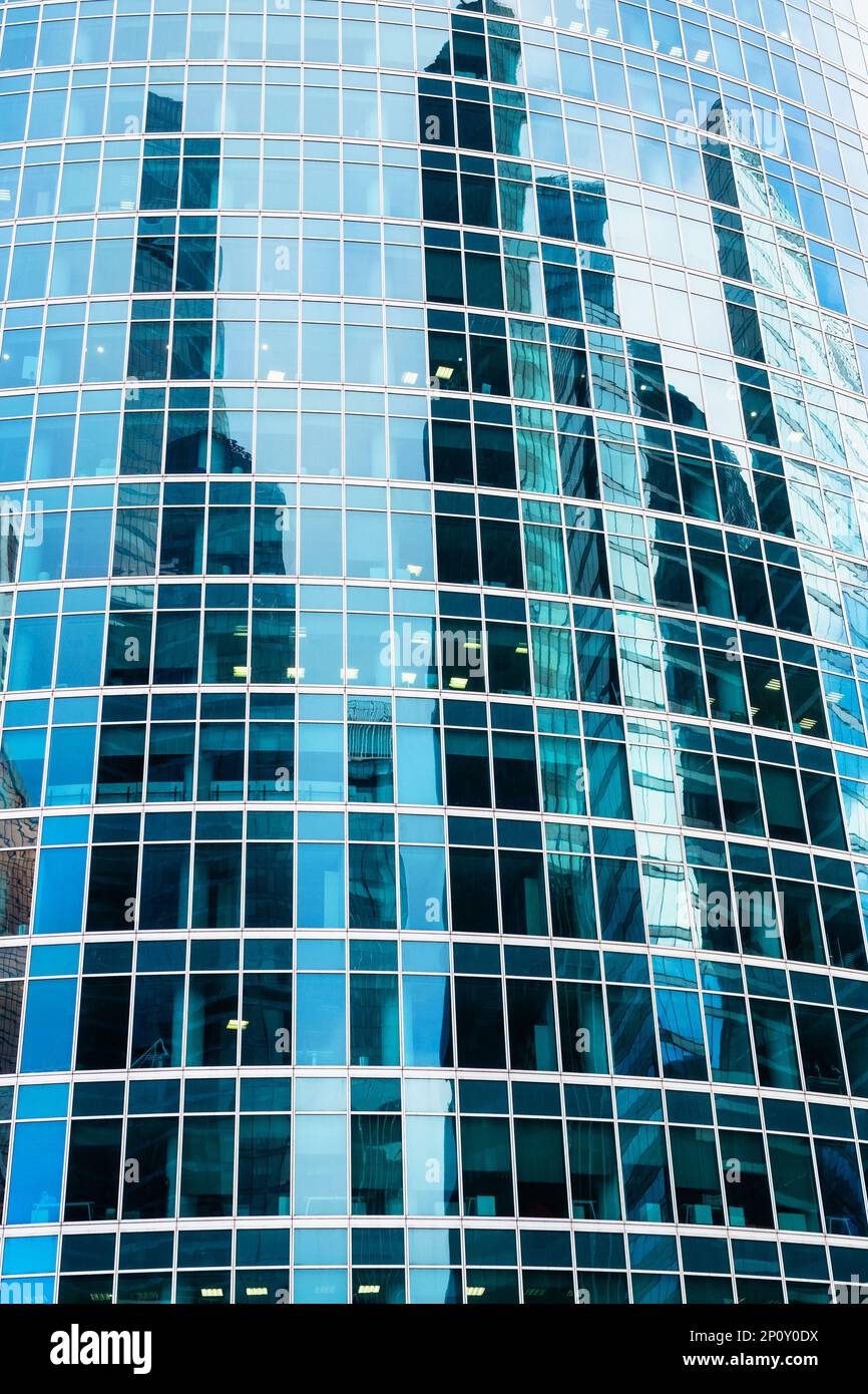 glass facade of skyscraper with reflection of towers in Moscow city ...