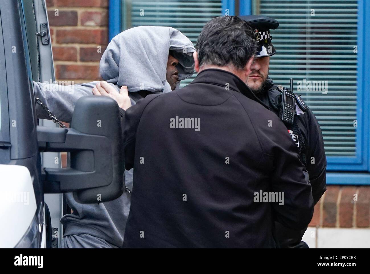 Mark Gordon is led into Crawley Police Station before being taken to ...