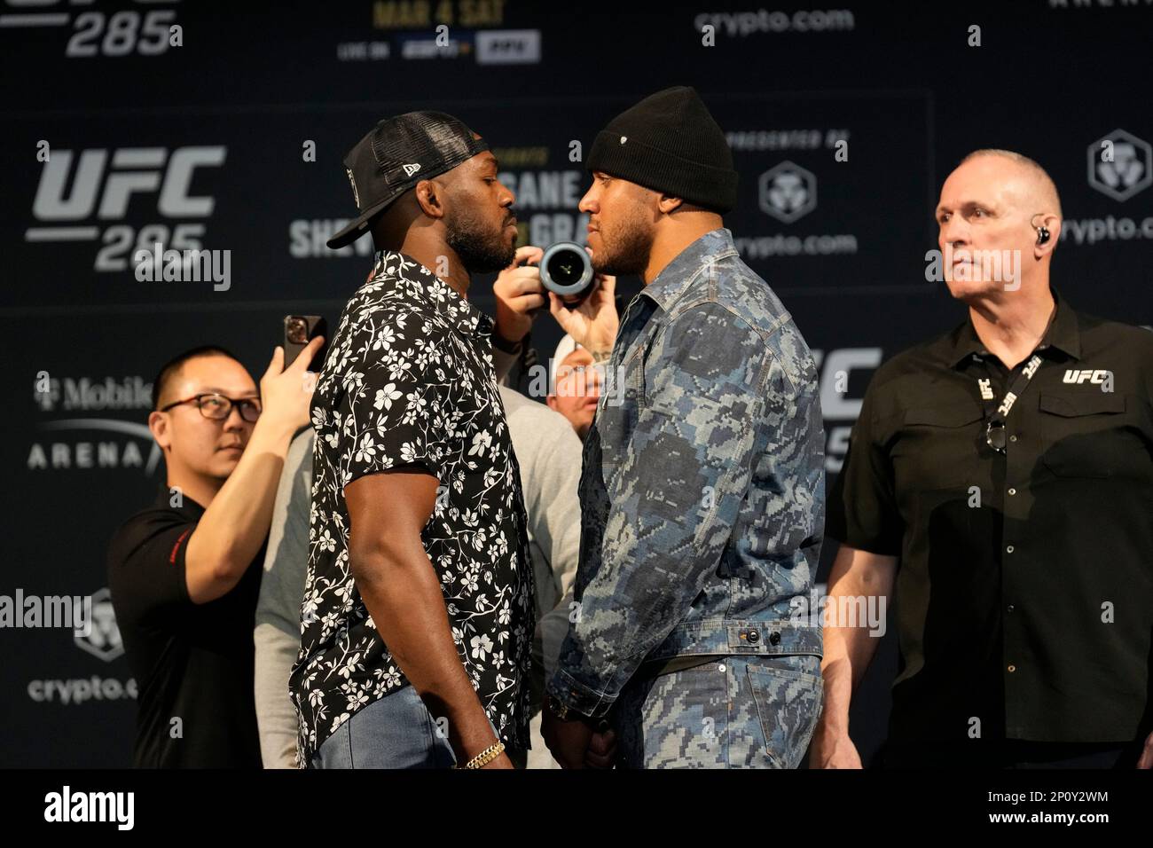 LAS VEGAS, NV - March 2: (L) Jon Jones and Cyril Gane face-off on stage ...