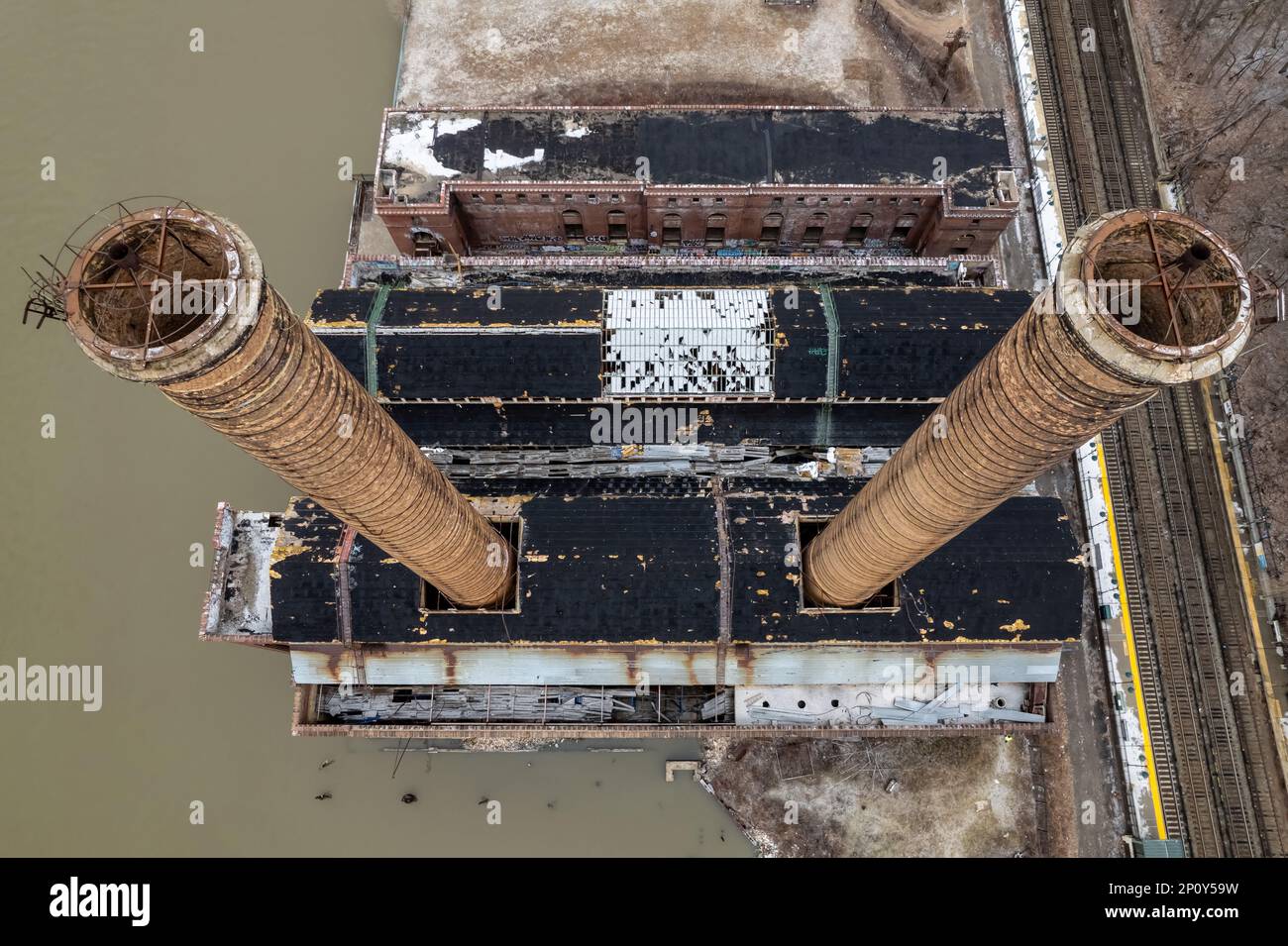 An aerial top view of two rustic industrial chimneys on the Hudson ...