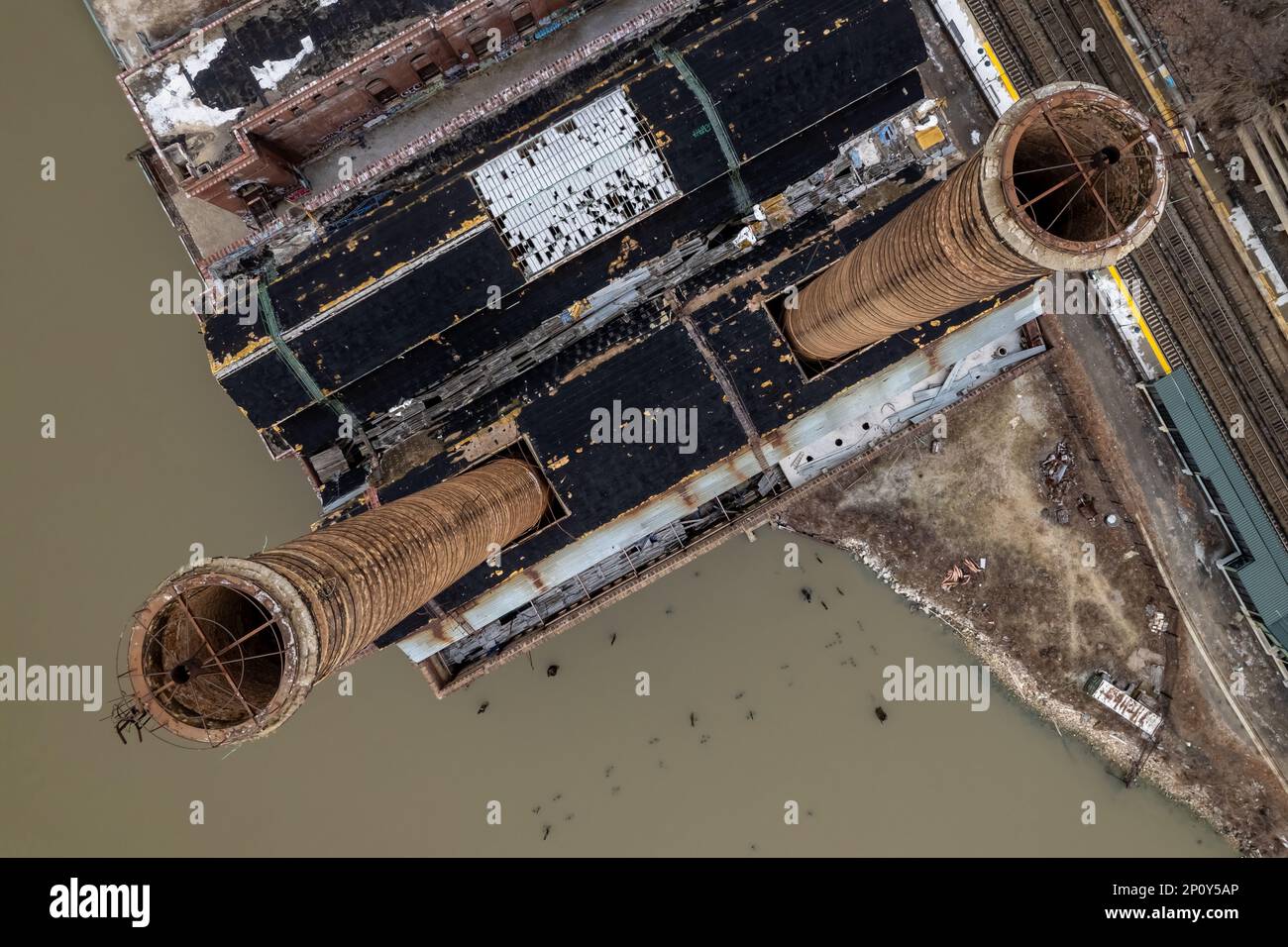 An aerial top view of two rustic industrial chimneys on the Hudson ...