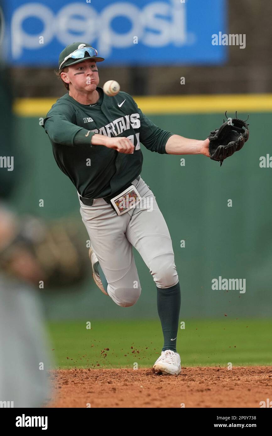 Shortstop Mitch Jebb (14) of the Michigan State Spartans fields a ...