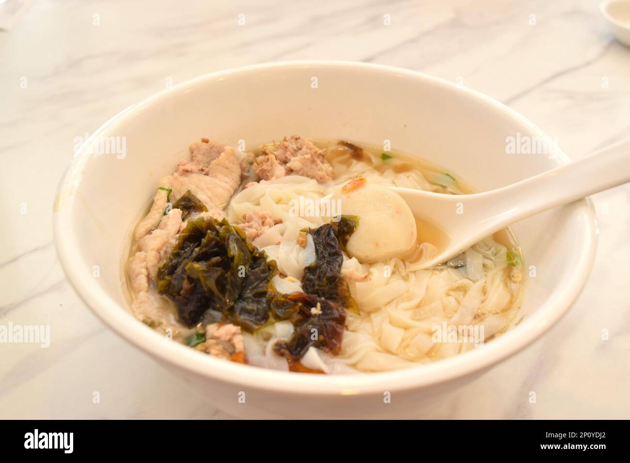 Chinese soup with noodles, chicken and seaweed Stock Photo - Alamy