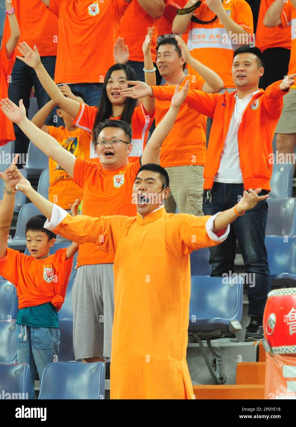 Chinese football fans shout slogans to show support for China's ...