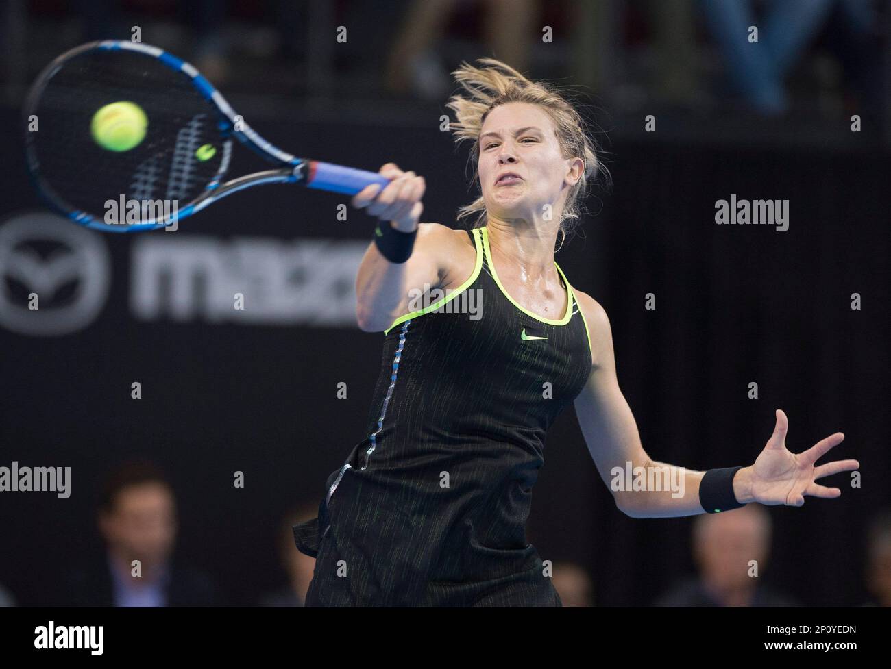 Eugenie Bouchard, of Canada, returns to Mandy Minella, of Luxembourg ...