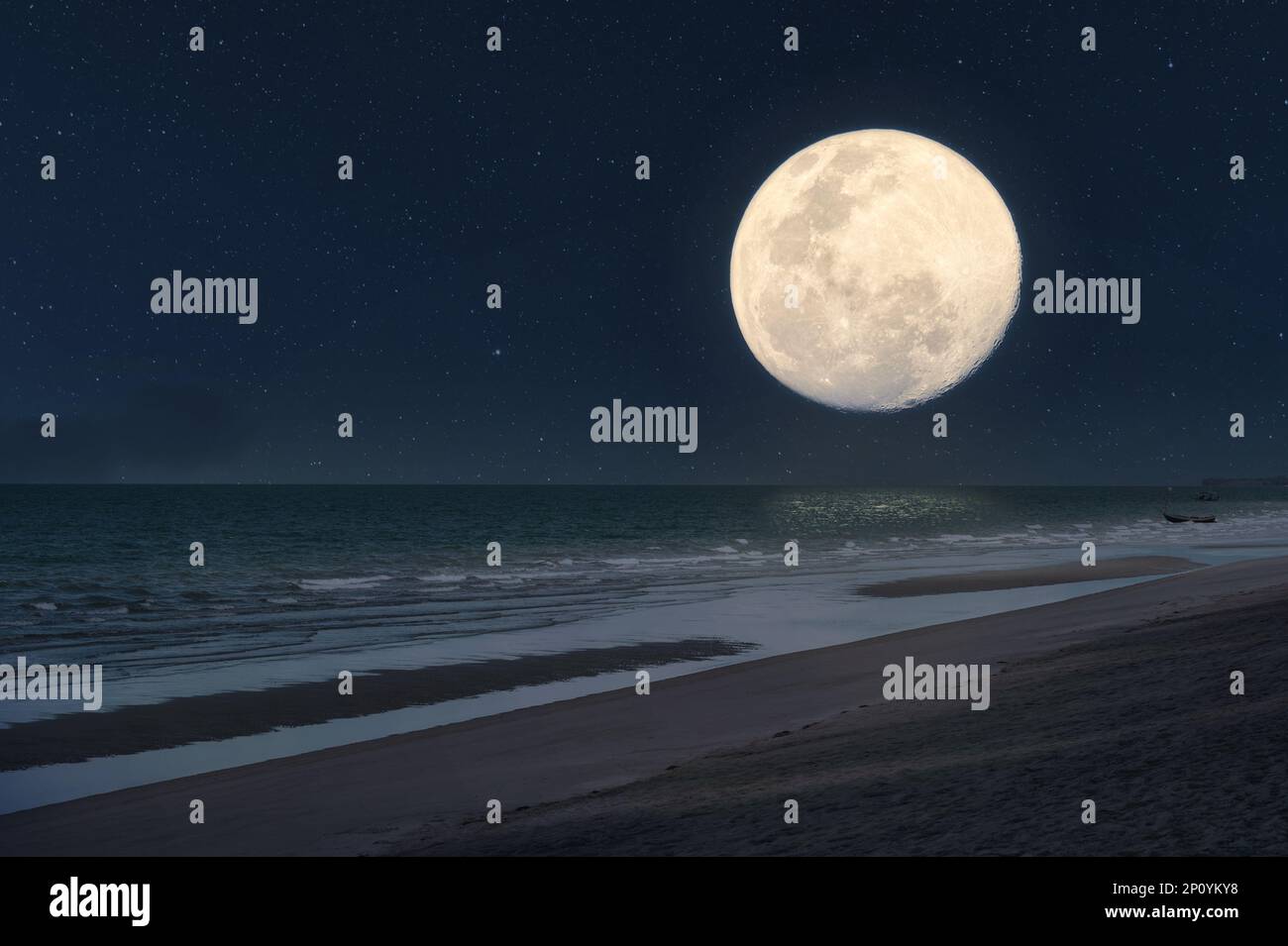 Big moon glowing over tropical sea and tranquil beach in summer at ...