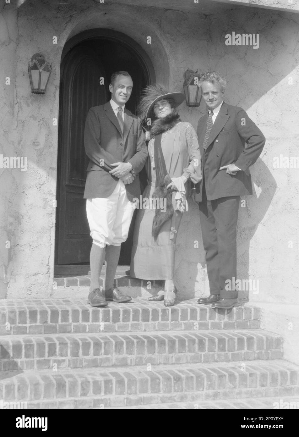 Slater, Mrs., and Arnold Genthe, with another friend on the steps of a ...