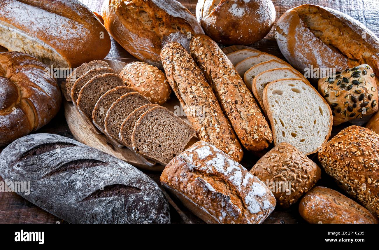 Assorted bakery products including loaves of bread and rolls Stock ...