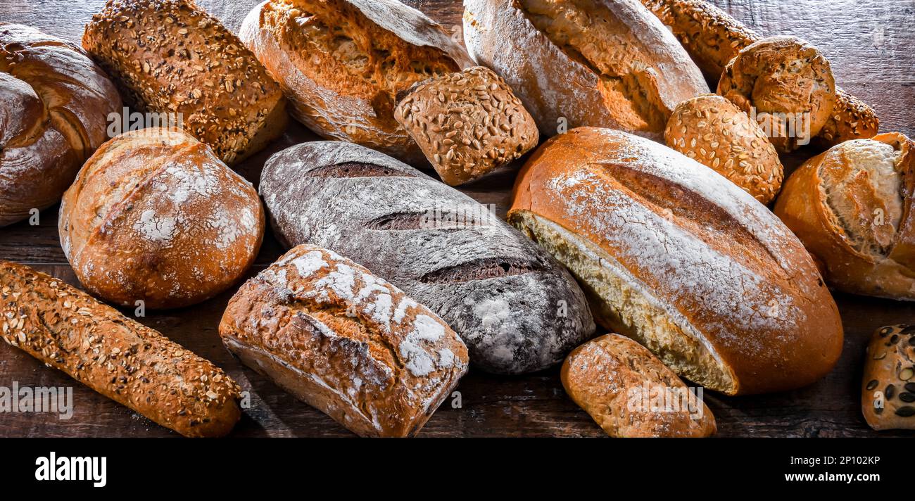 Assorted bakery products including loaves of bread and rolls Stock ...