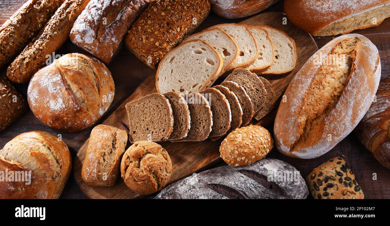 Assorted bakery products including loaves of bread and rolls Stock ...