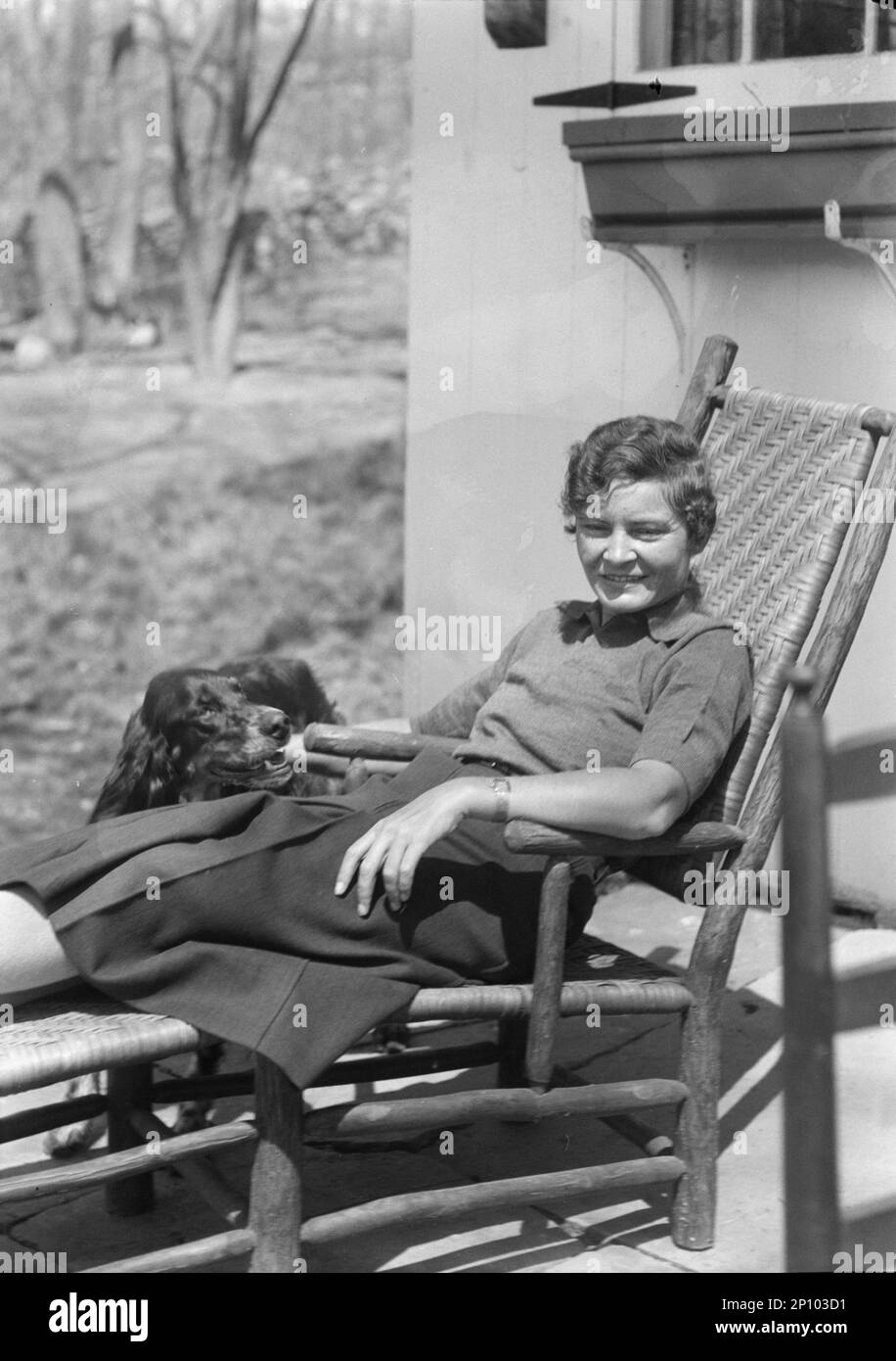 DeLamar, Alice, Miss, with dog, seated outdoors, between 1927 and 1942 ...