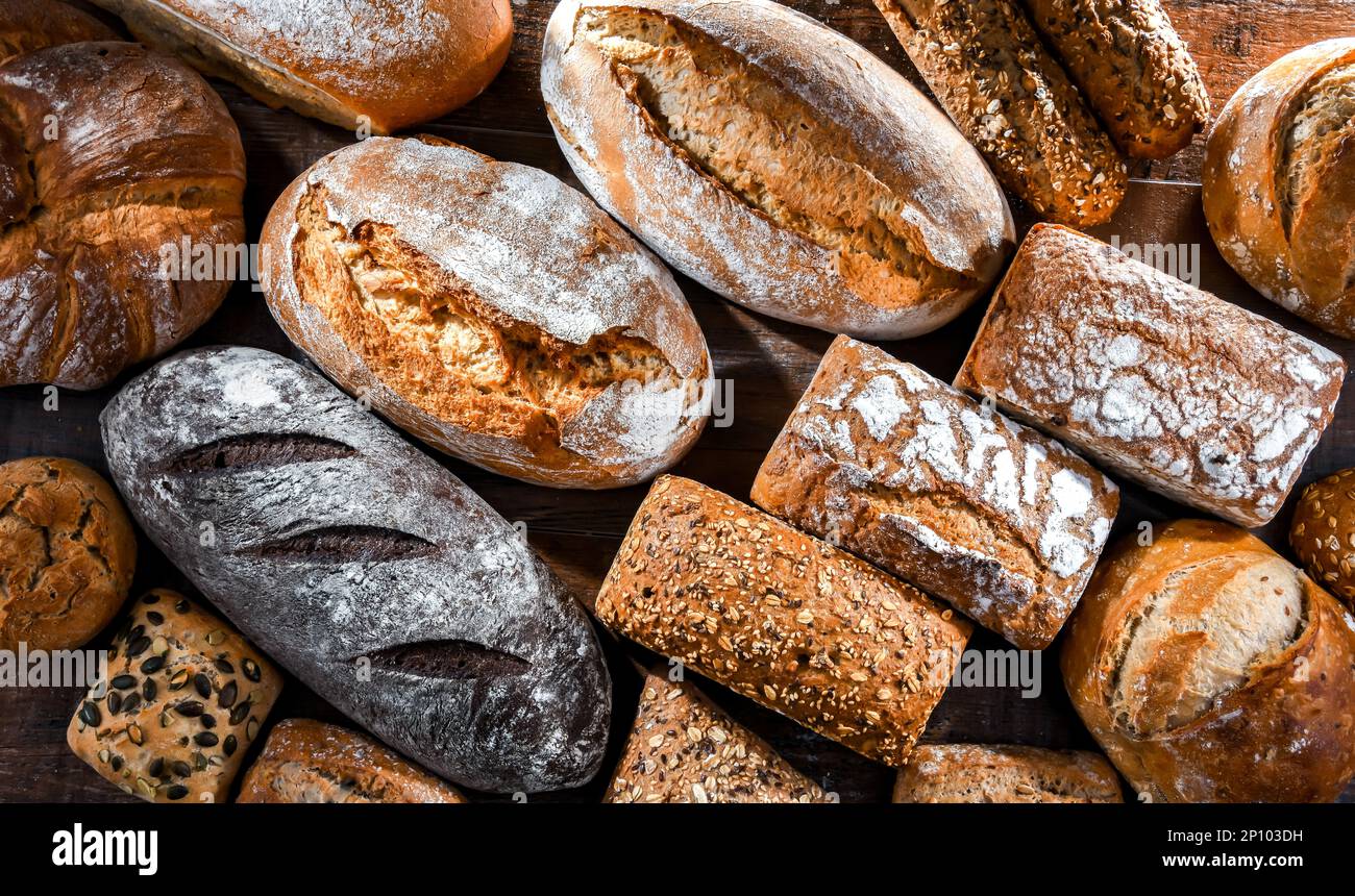 Assorted bakery products including loaves of bread and rolls Stock ...
