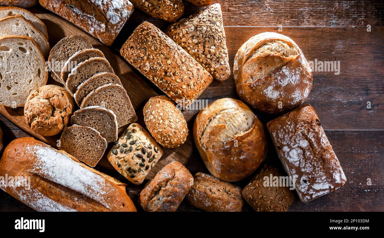 Assorted bakery products including loaves of bread and rolls Stock ...