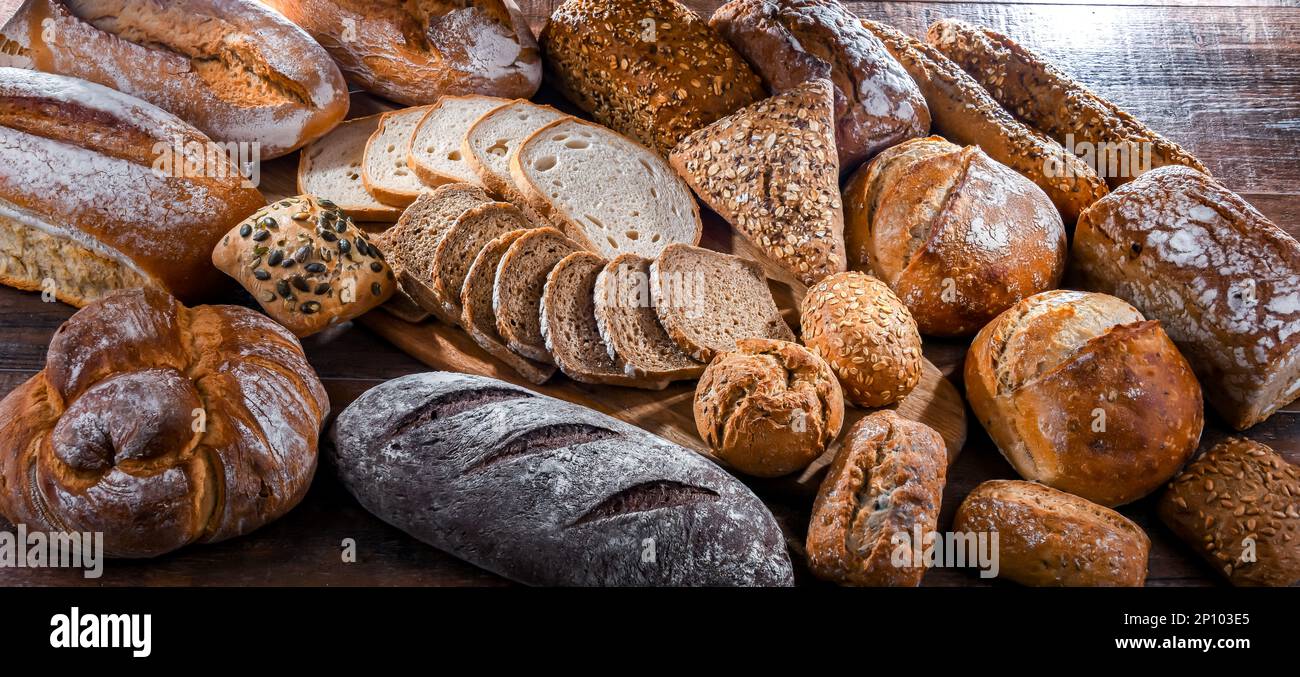Assorted bakery products including loaves of bread and rolls Stock ...