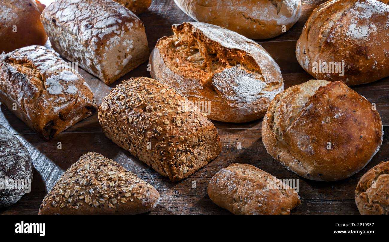 Assorted bakery products including loaves of bread and rolls Stock ...