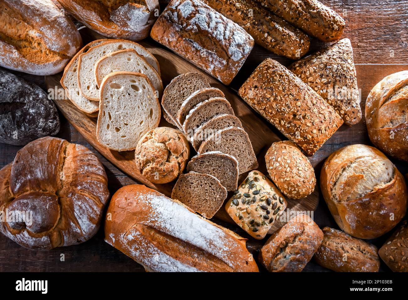 Assorted bakery products including loaves of bread and rolls Stock ...