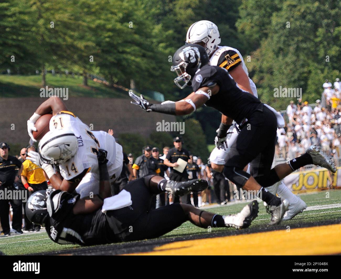 Appalachian State running back Marcus Cox (14) rolls into the end zone ...