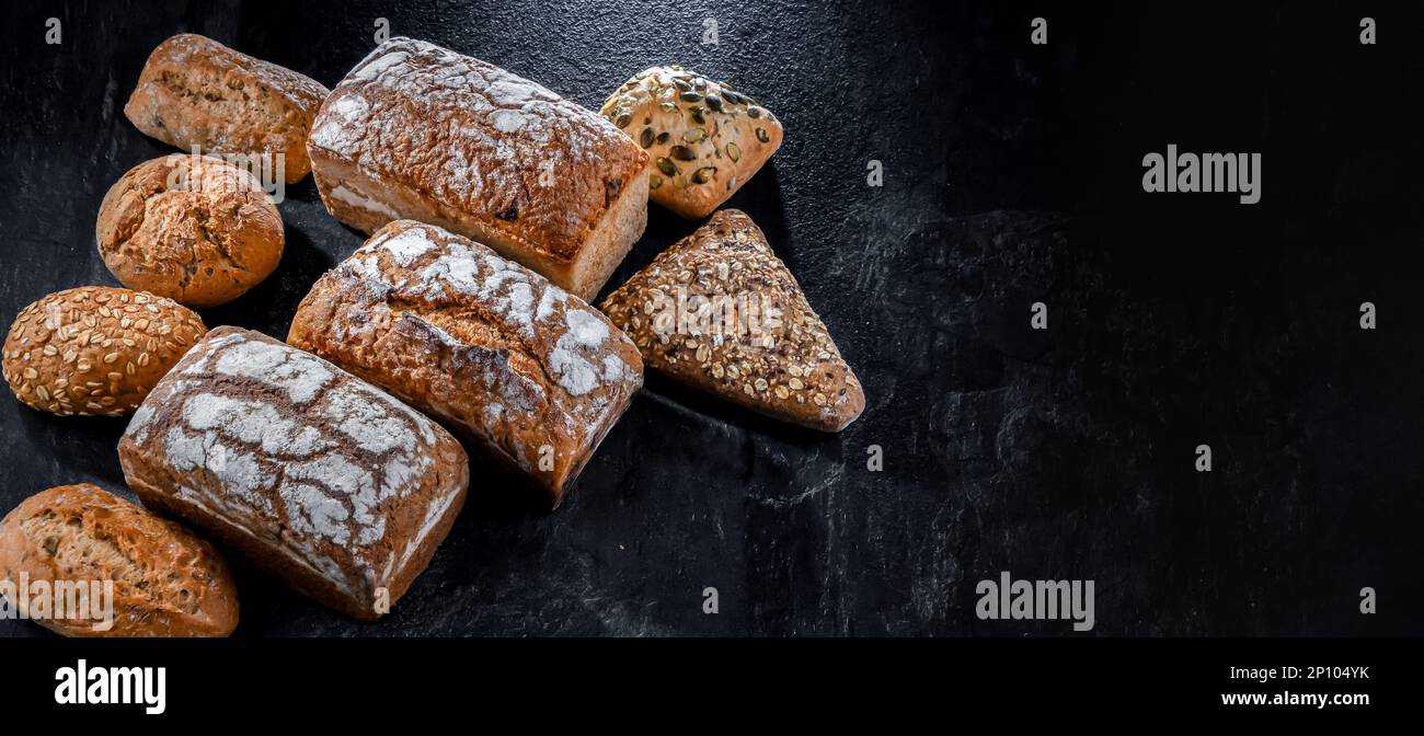 Assorted bakery products including loaves of bread and rolls Stock ...