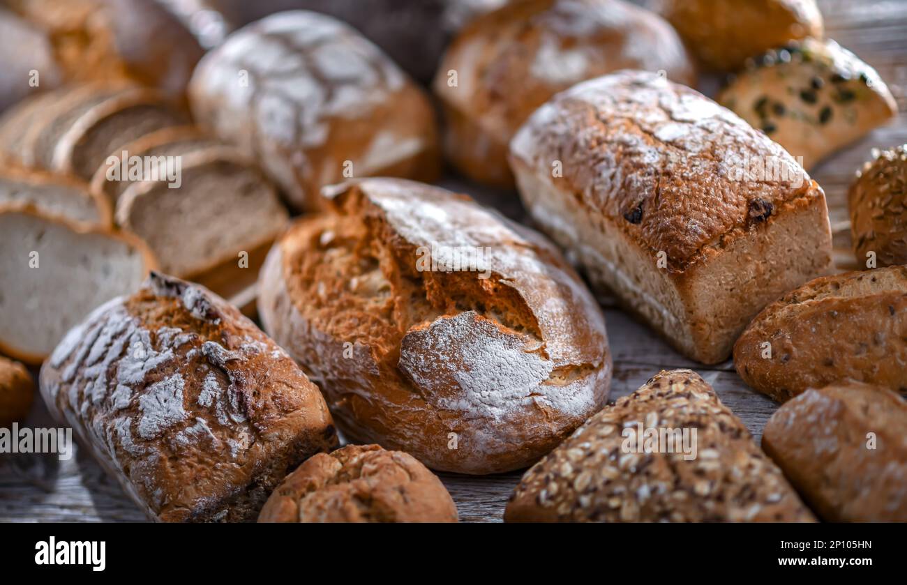 Assorted bakery products including loaves of bread and rolls Stock ...