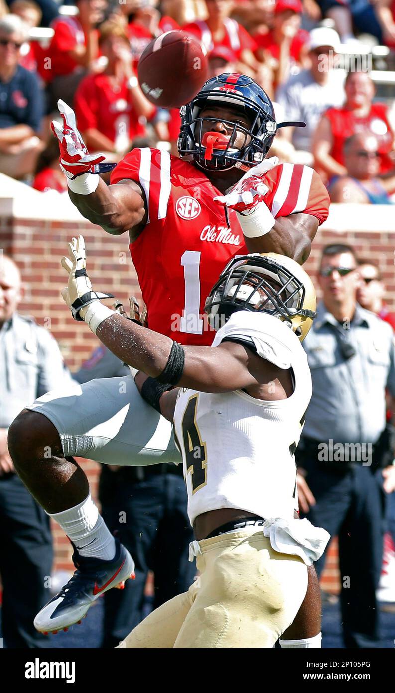 Mississippi wide receiver D.K. Metcalf (14) reaches over Wofford ...