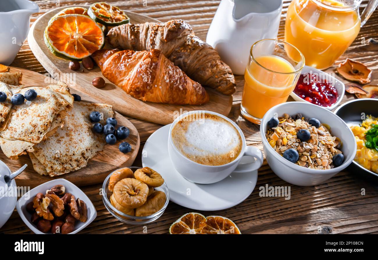 Breakfast served with coffee, orange juice, scrambled eggs, cereals ...