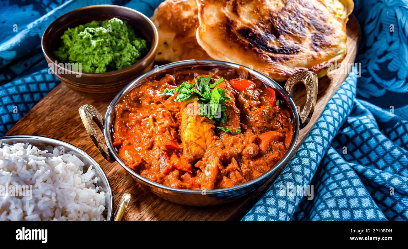 Butter chicken with rice and naan flatbread served in original indian ...