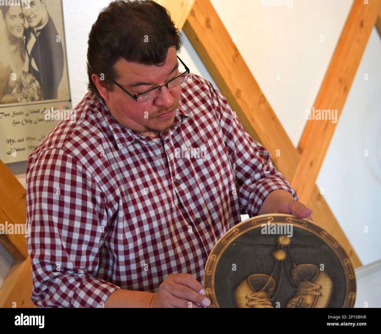 In this recent photo, Patrick O'Berry displays laser-cut wood artwork ...