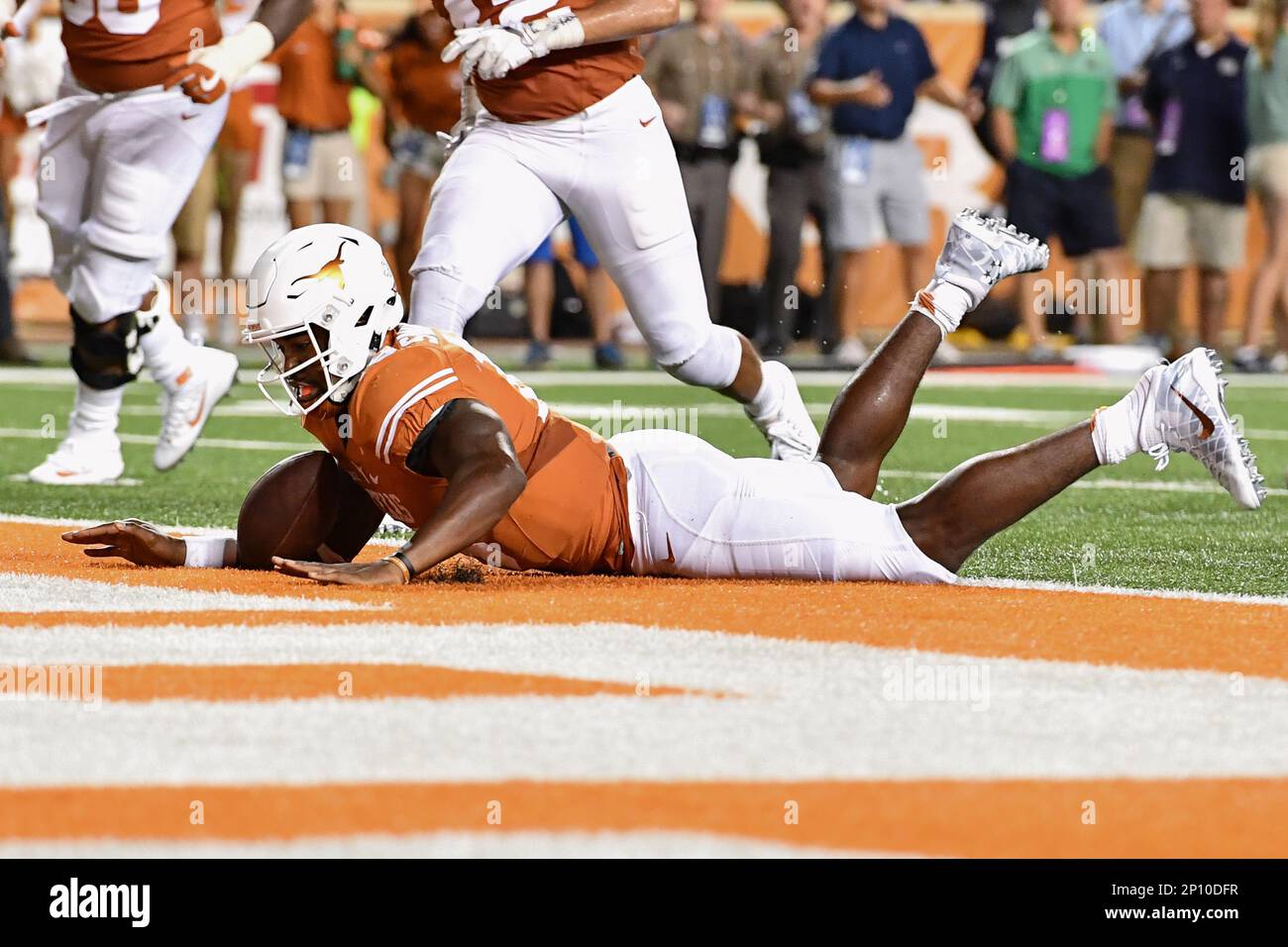 Texas quarterback Tyrone Swoopes (18) lands in the endzone after ...