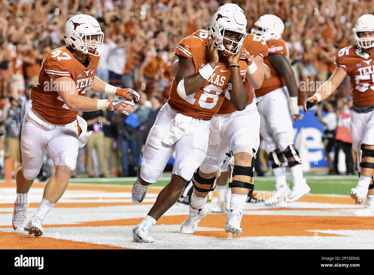 Texas quarterback Tyrone Swoopes (18) celebrates game winning touchdown ...