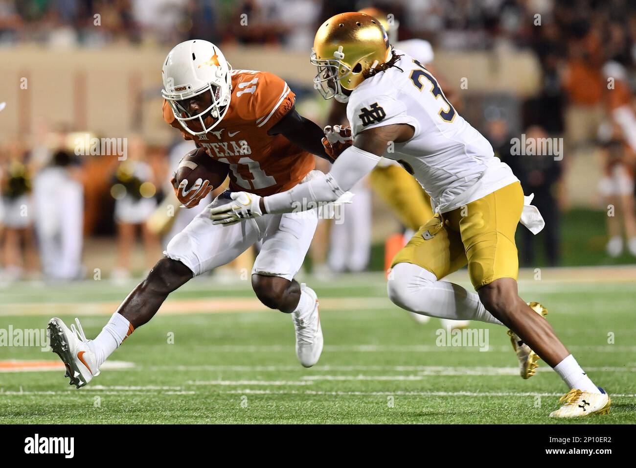 Notre Dame cornerback Cole Luke (36) tackles Texas wide receiver ...