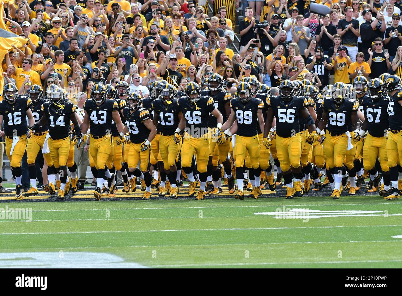 03 SEP 2016: The Iowa Hawkeyes football team swarms on to the field ...