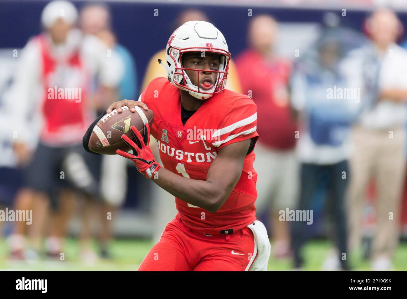 Houston Cougars quarterback Greg Ward Jr. (1) looks on during the first ...