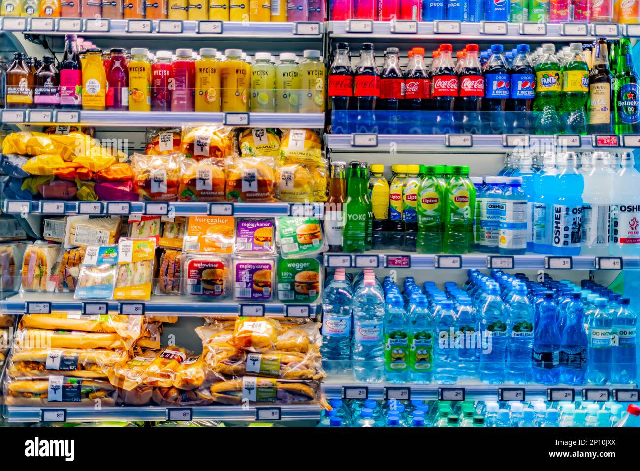POZNAN, POL - MAR 12, 2022: Pre-packaged food and drinks displayed in a ...
