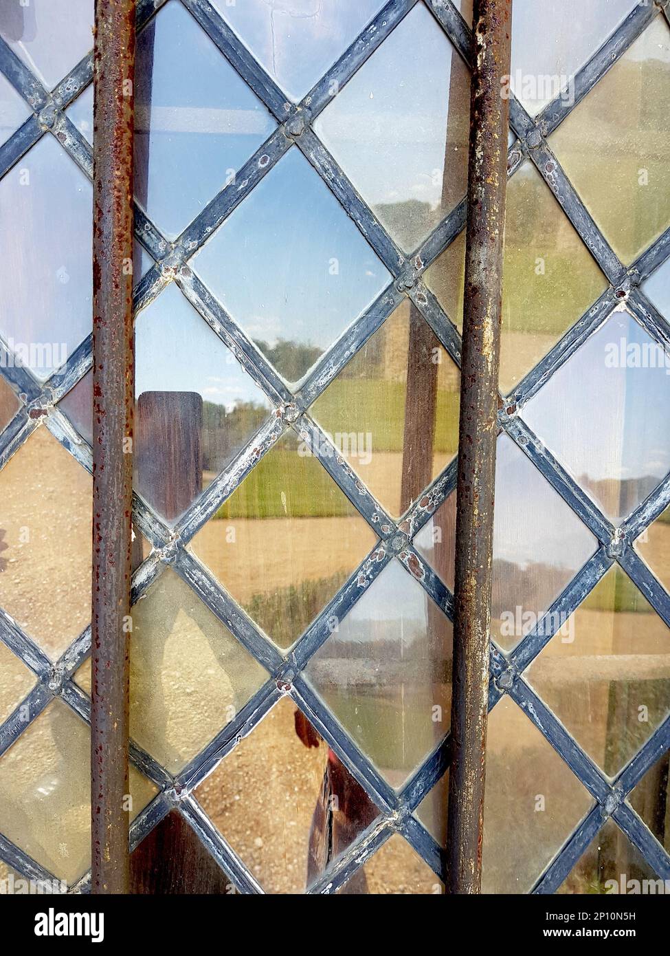 Detail of a decorative lattice window with rusty iron bars Stock Photo ...