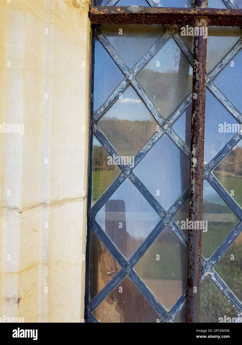 Detail of a decorative lattice window with rusty iron bars Stock Photo ...