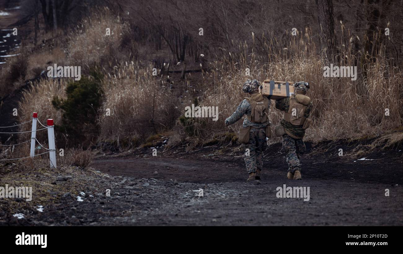 U.S. Marines with 3d Battalion, 4th Marines prepare a cratering charge ...