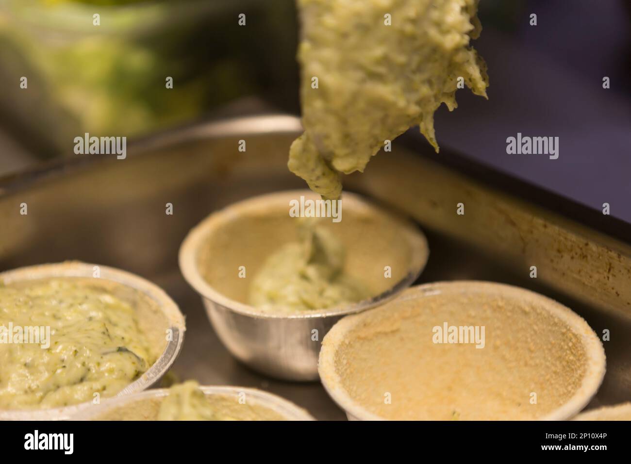 Close up detail of the making of a souffle recipe inside an industrial ...