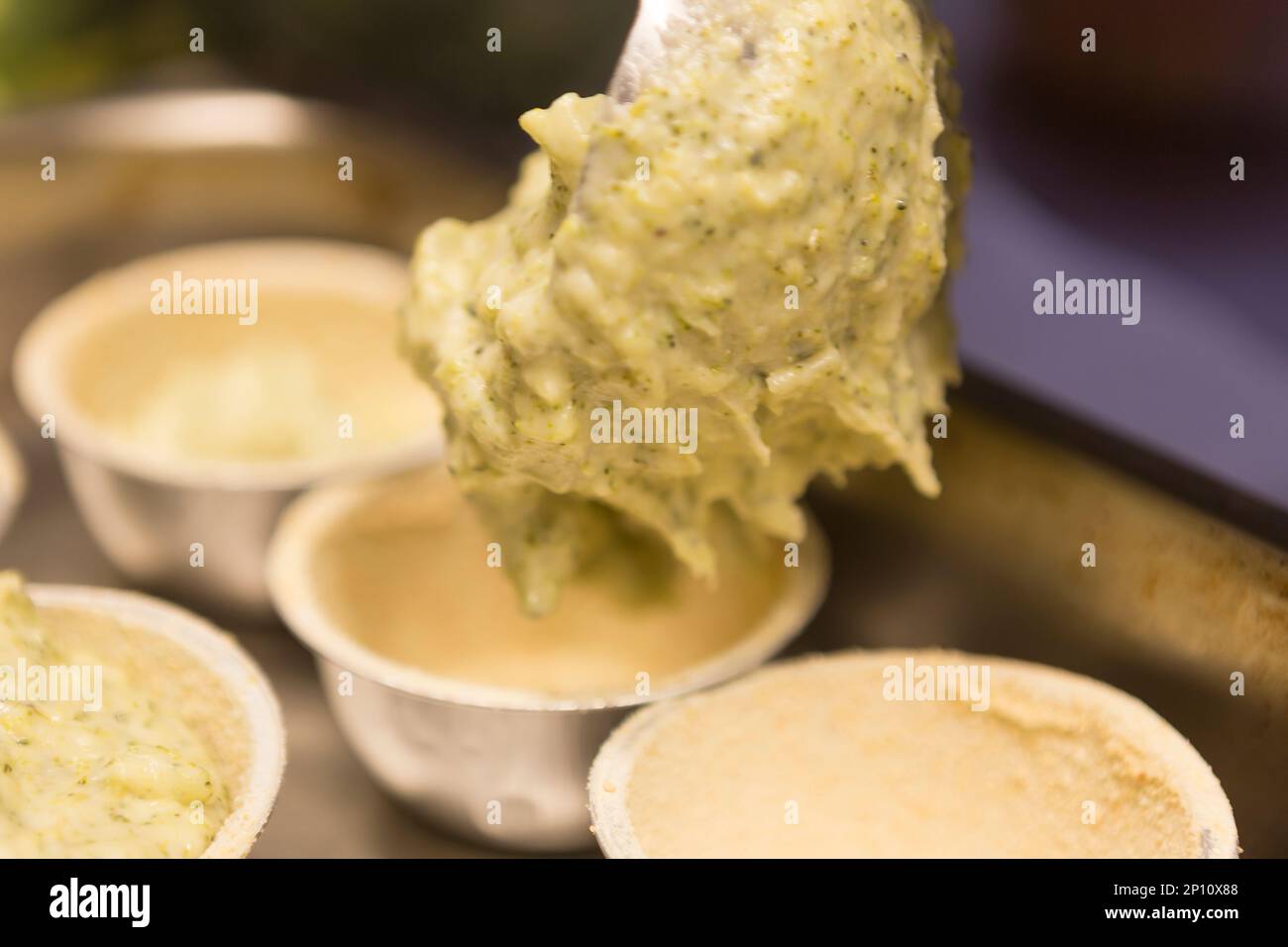 Close up detail of the making of a souffle recipe inside an industrial ...