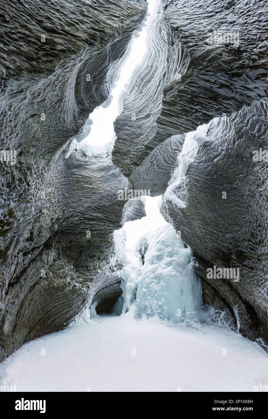 Majestic natural frozen limestone mountain cave in winter season at ...