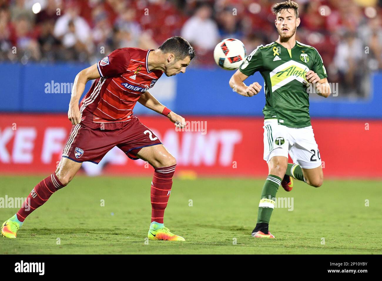 FC Dallas defender Matt Hedges (24) clears the ball with a header ...