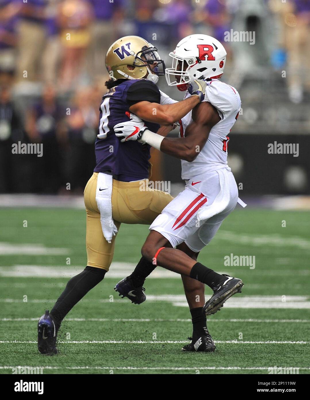 University of Washington receiver Dante Pettis (8) and Rutgers defender ...