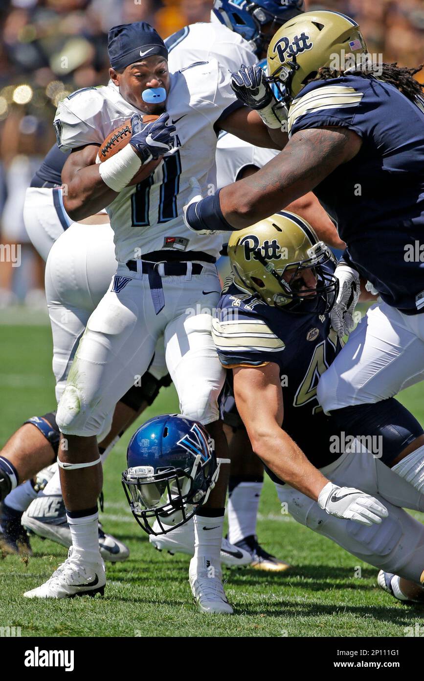 Villanova running back Javon White (11) has his helmet ripped off by ...