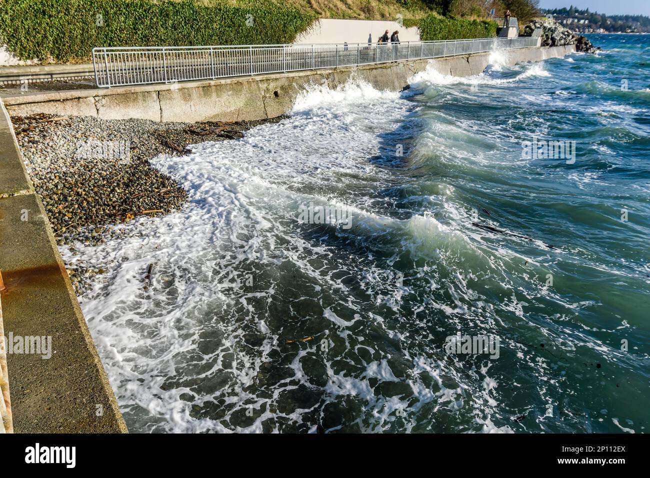 Wind blows waves into the sea wall in West Seattle, Washingon Stock ...