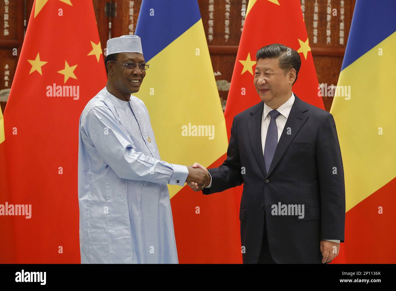 China's President Xi Jinping, right, greets Chad President Idriss Deby ...