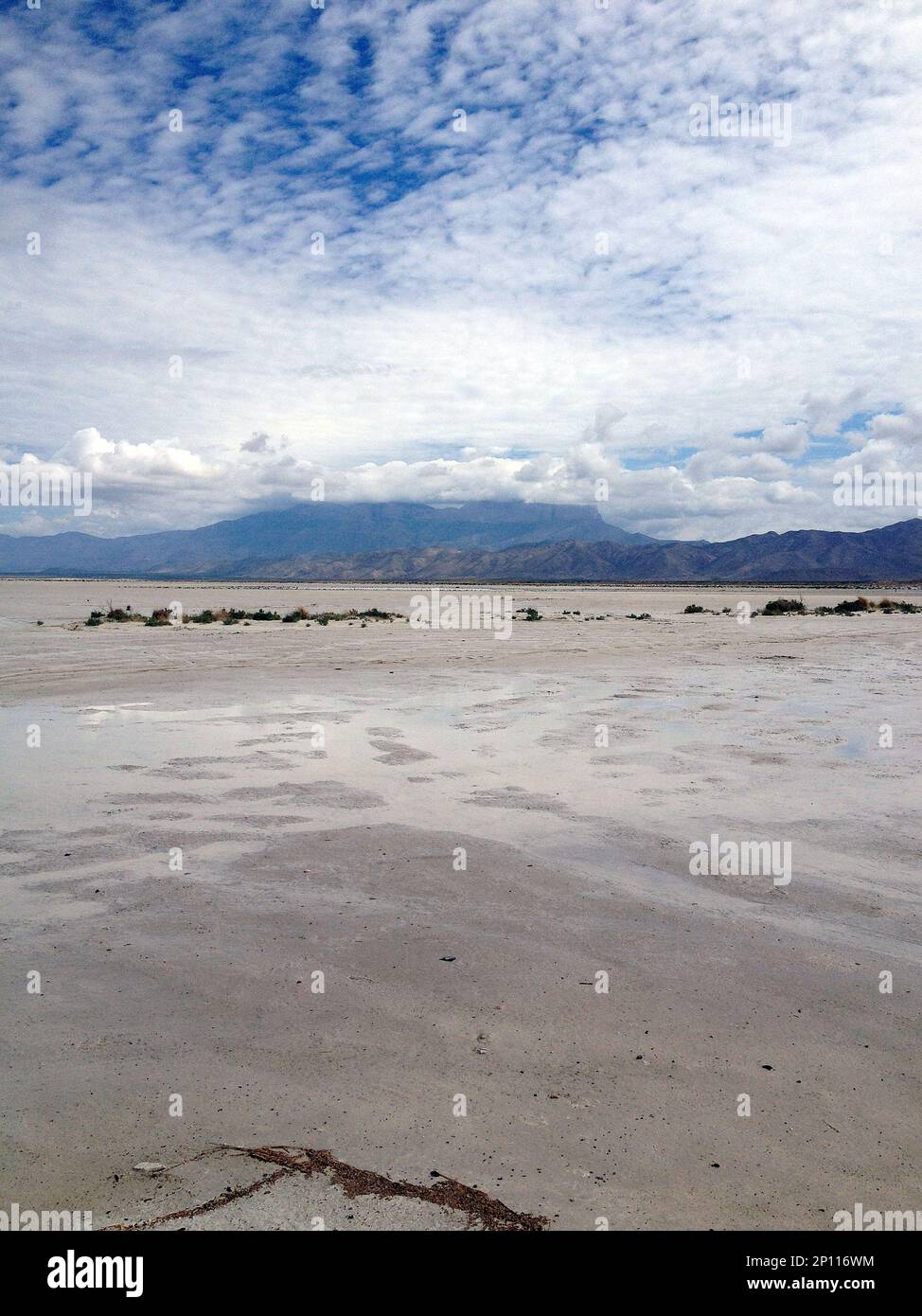 In this Aug. 22, 2016 photo, the barren salt flats at the base of the ...
