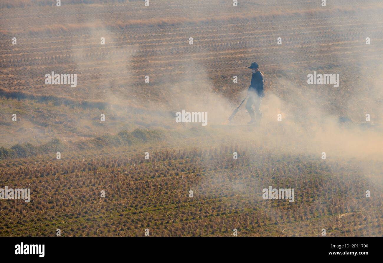 Hyogo, Japan - February 5, 2023: Smoke rises around masked man during ...