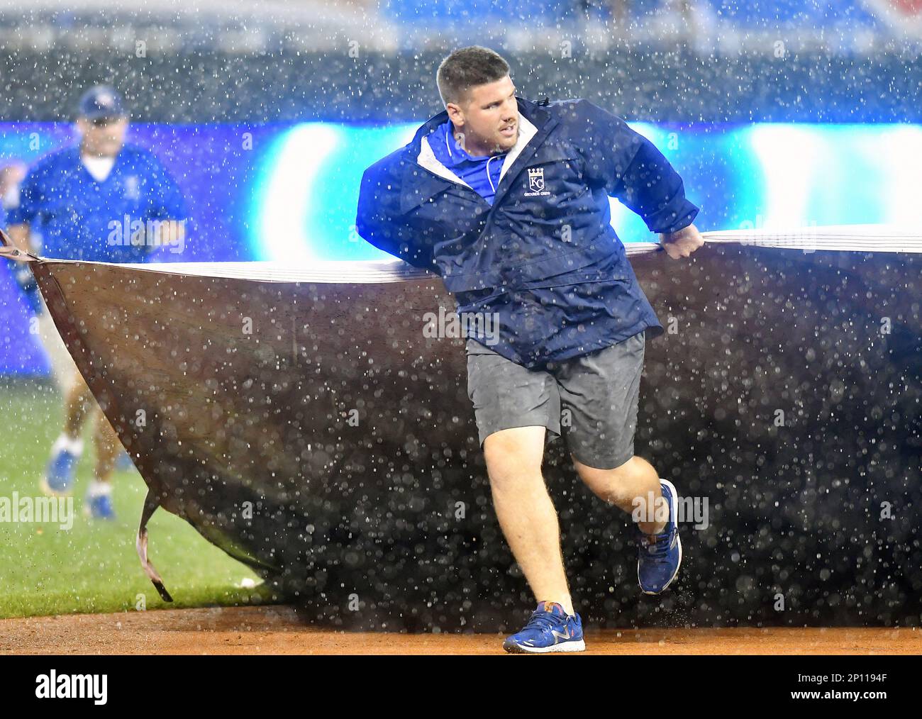 30 AUG 2016: The grounds crew covers the field after the fifth inning ...